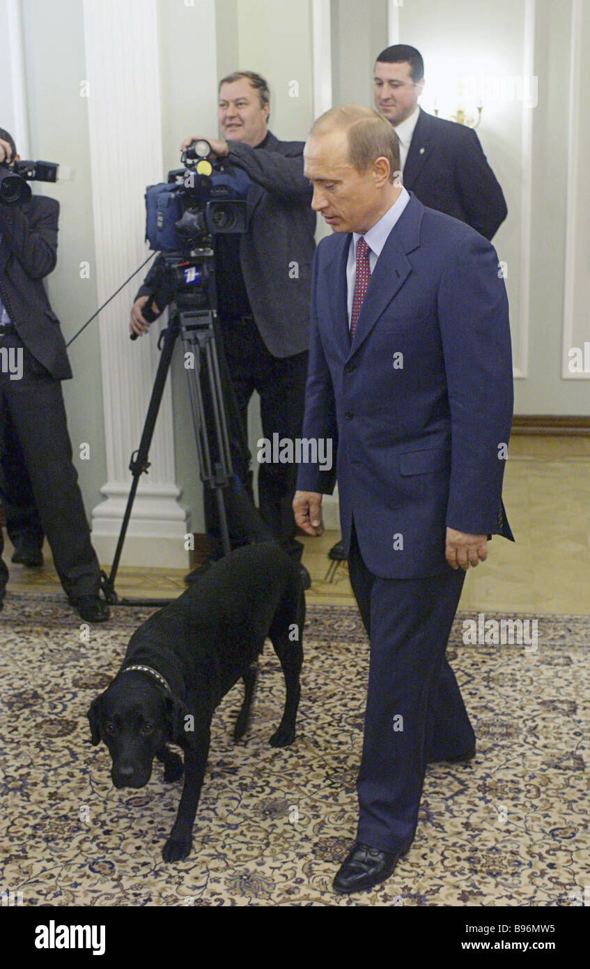 Russian President Vladimir Putin with his dog named Connie at his ...