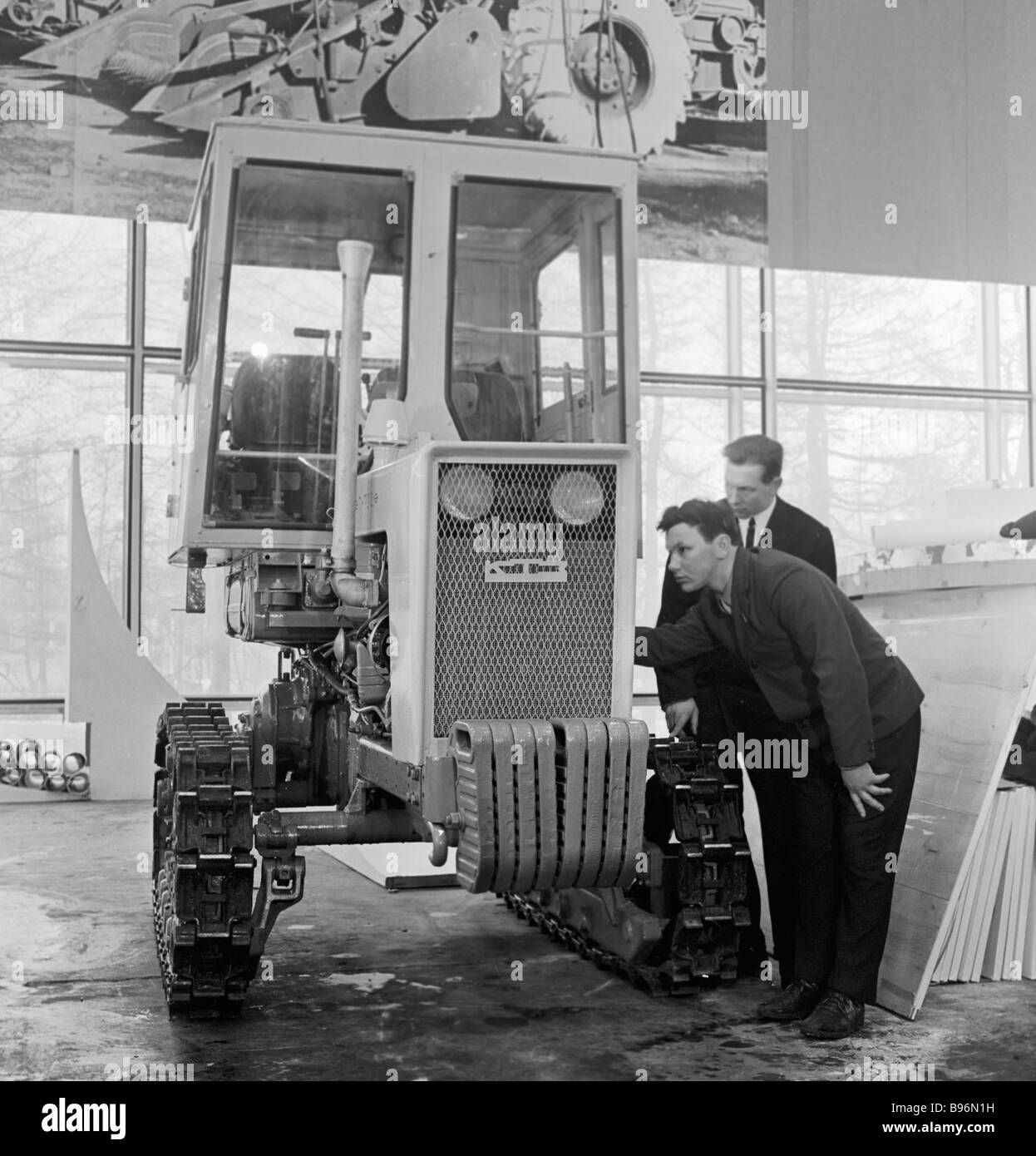 Workers examining the T 40 tractor at the Kishinev Tractor Plant Stock ...