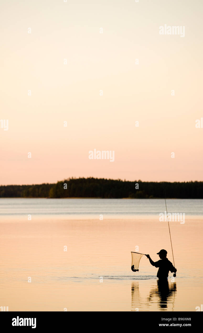 Holding fishing net pole hi-res stock photography and images - Alamy