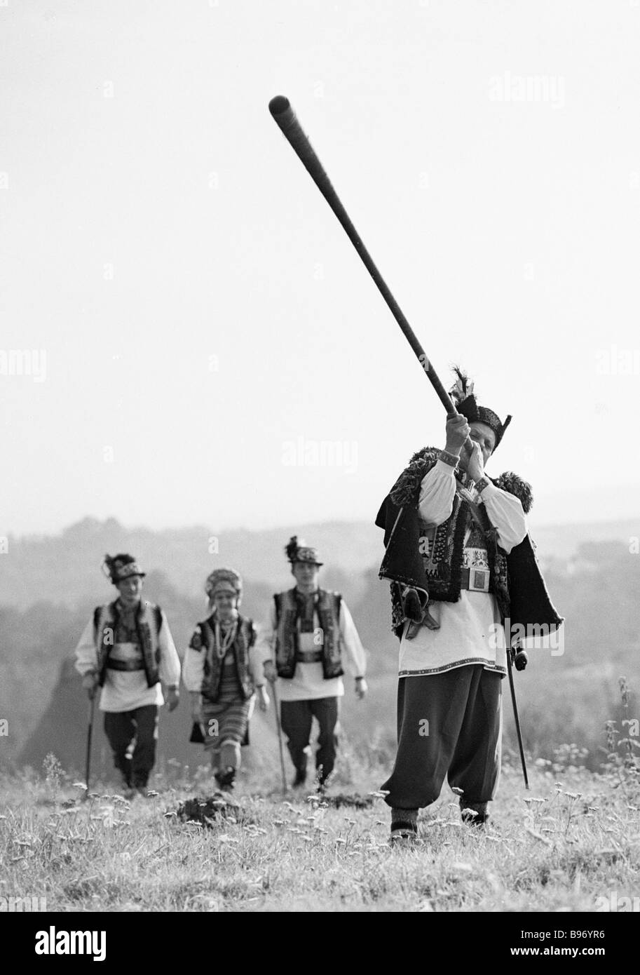Playing Ukrainian folk instrument trembita Stock Photo - Alamy