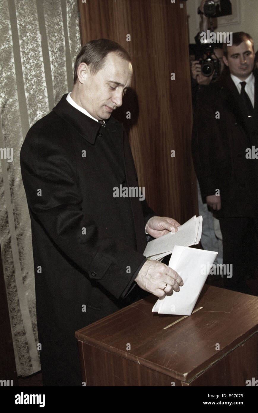 Russian Prime Minister Vladimir Putin at the polling station during the ...