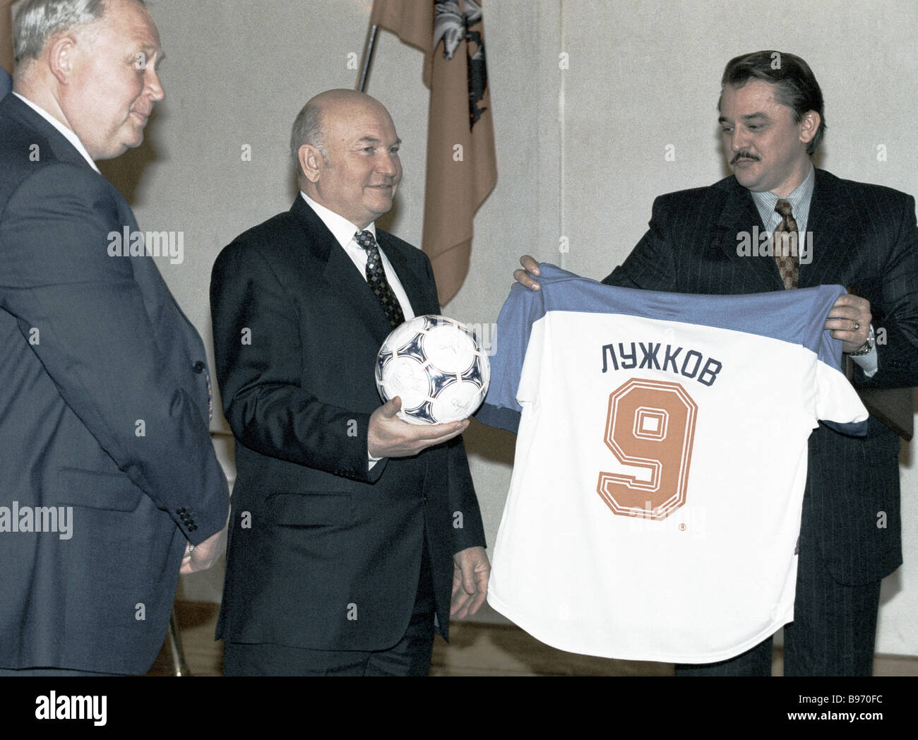 Members of Russian mini football national team present a football and ...