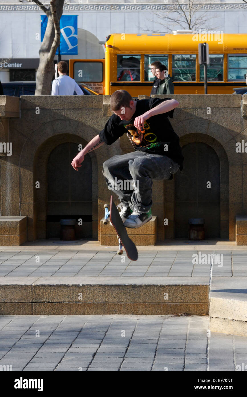 Freestyle Skateboarder Kickflip off a high curb Stock Photo - Alamy