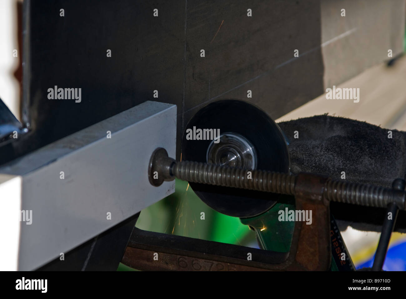 Using a gringer and cutting wheels to cut plate steel metal for a ...