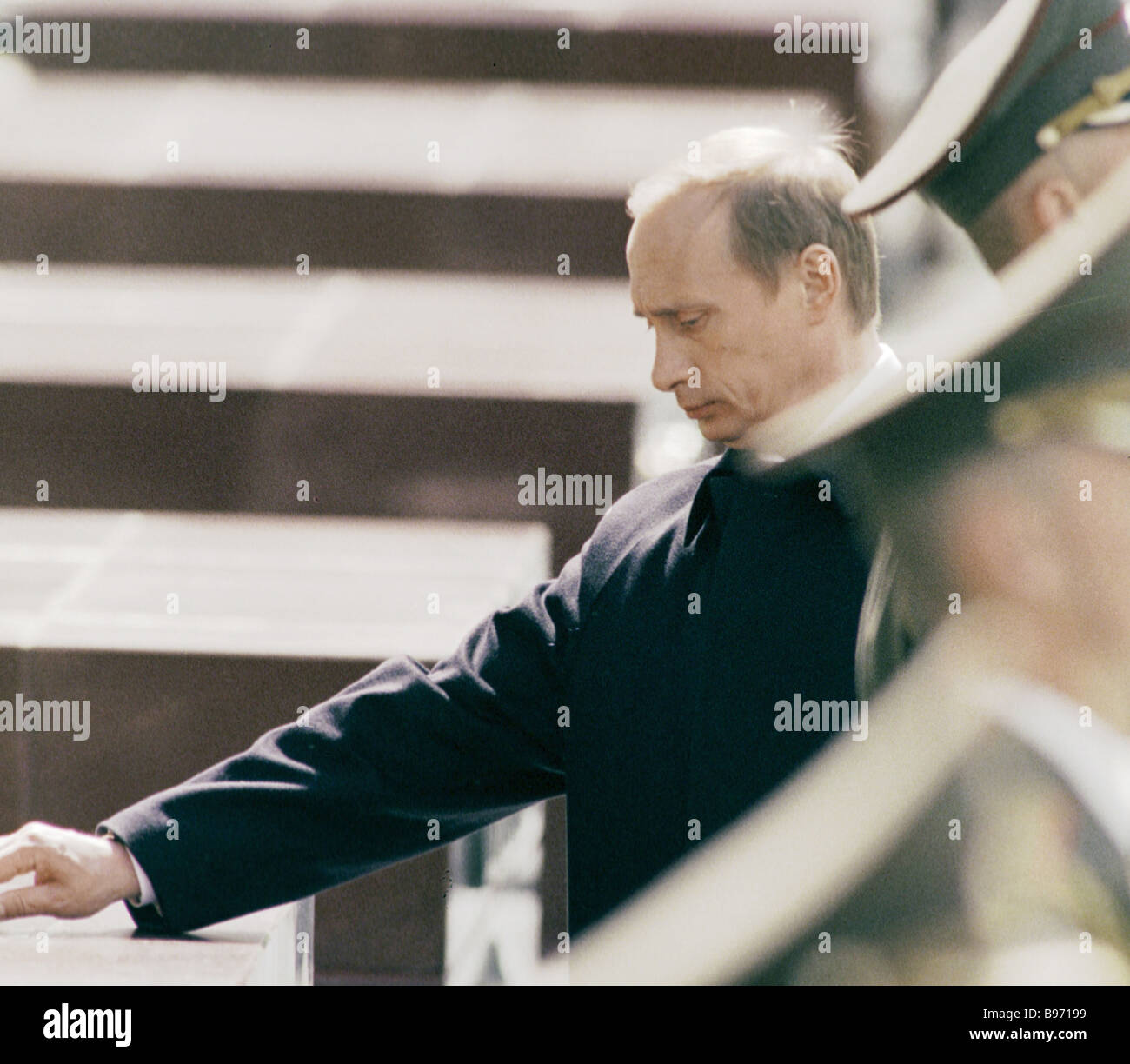 Russian President Vladimir Putin putting flowers on the Tomb of the ...