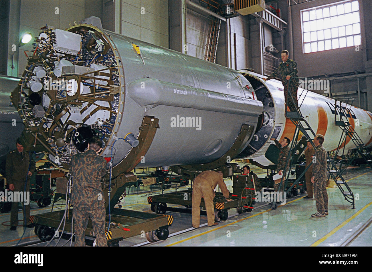 Putting together stages of Kosmos rocket at vehicle assembly building ...