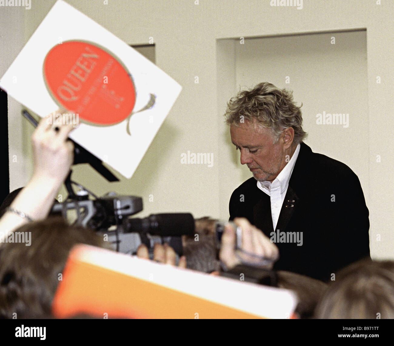 Roger Taylor the drummer of the Queen group signing autographs during a ...