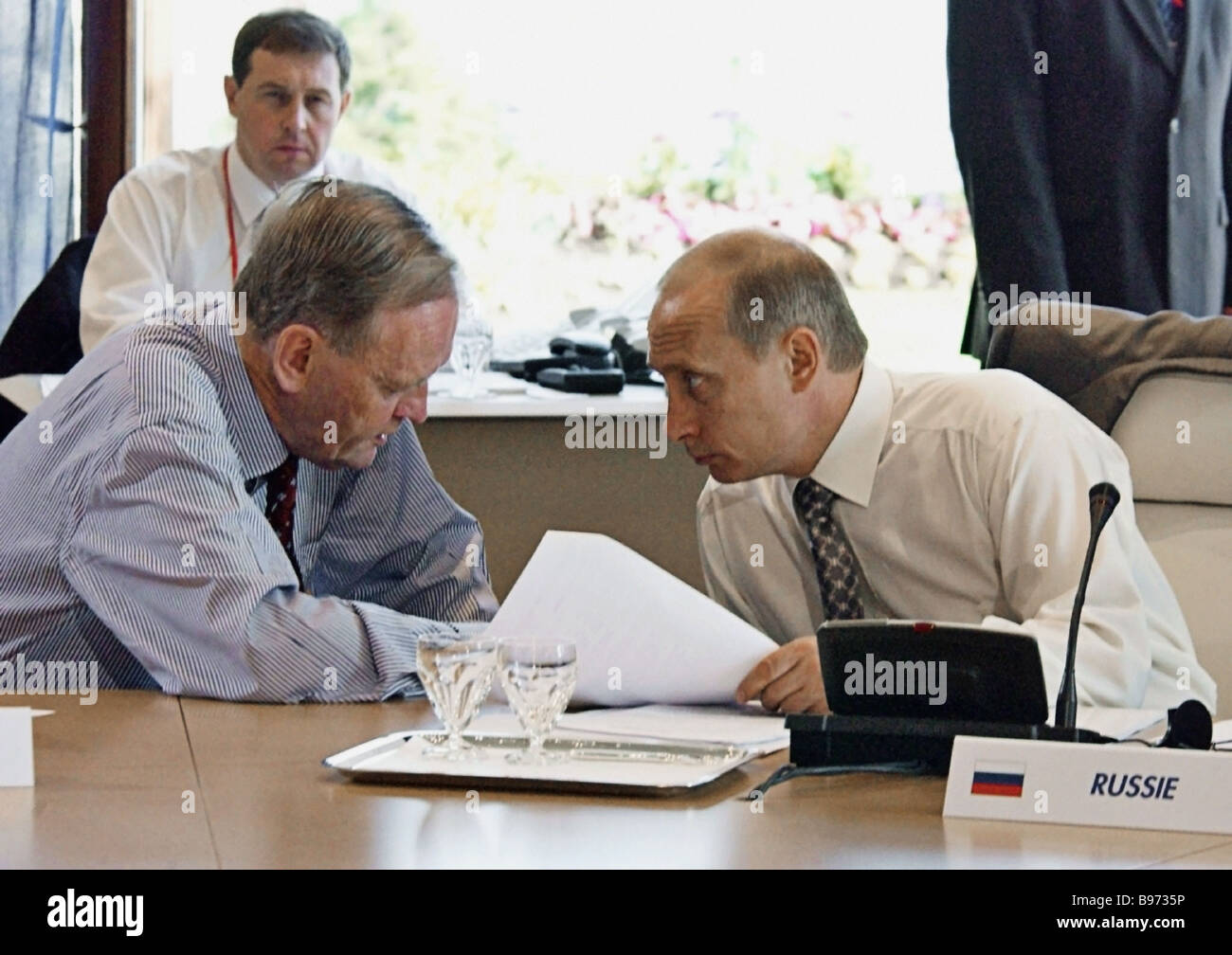 President Vladimir Putin right and Canadian Prime Minister Jean ...