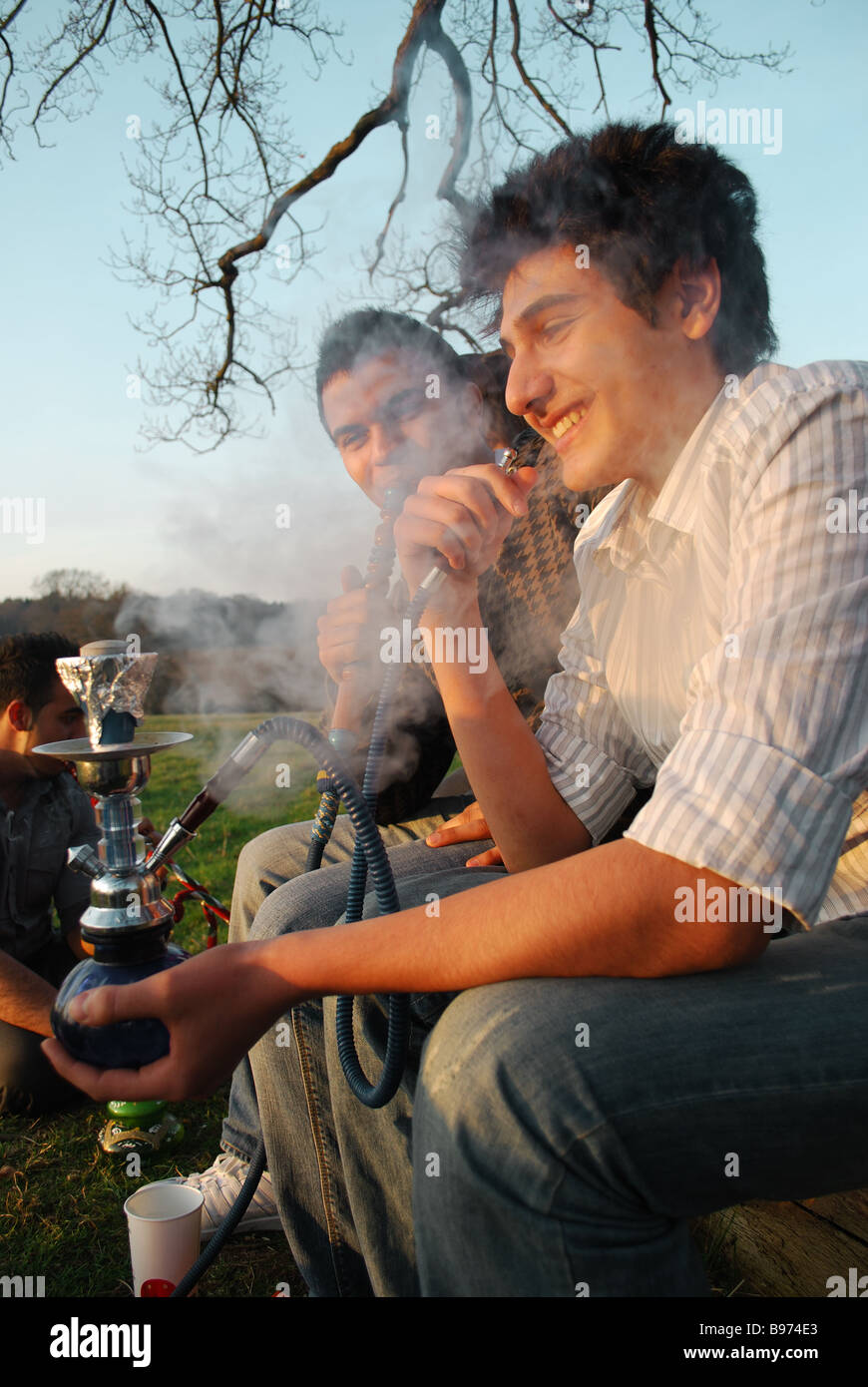 People smoking shisha Stock Photo - Alamy