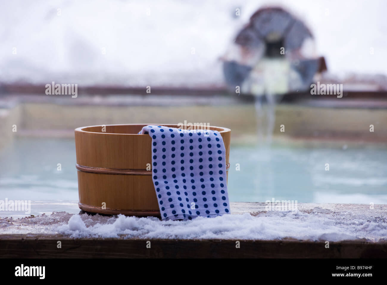 Hot spring and towel on wooden tub Stock Photo - Alamy