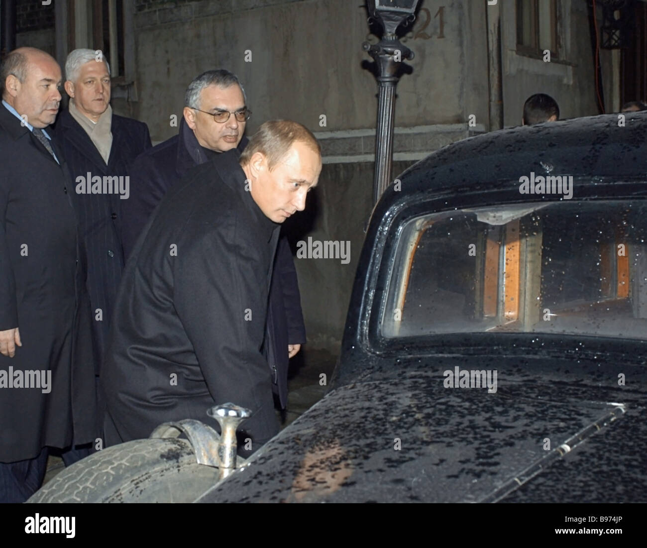 Russian President Vladimir Putin in the foreground examining vintage ...