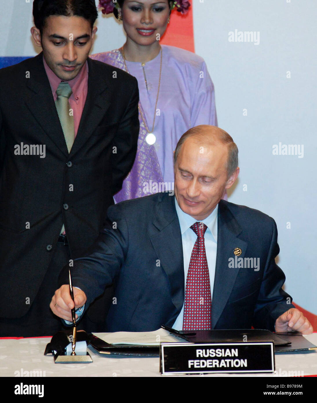 Russian President Vladimir Putin foreground at the ceremony of signing ... Russian President Vladimir Putin foreground at the ceremony of signing ...