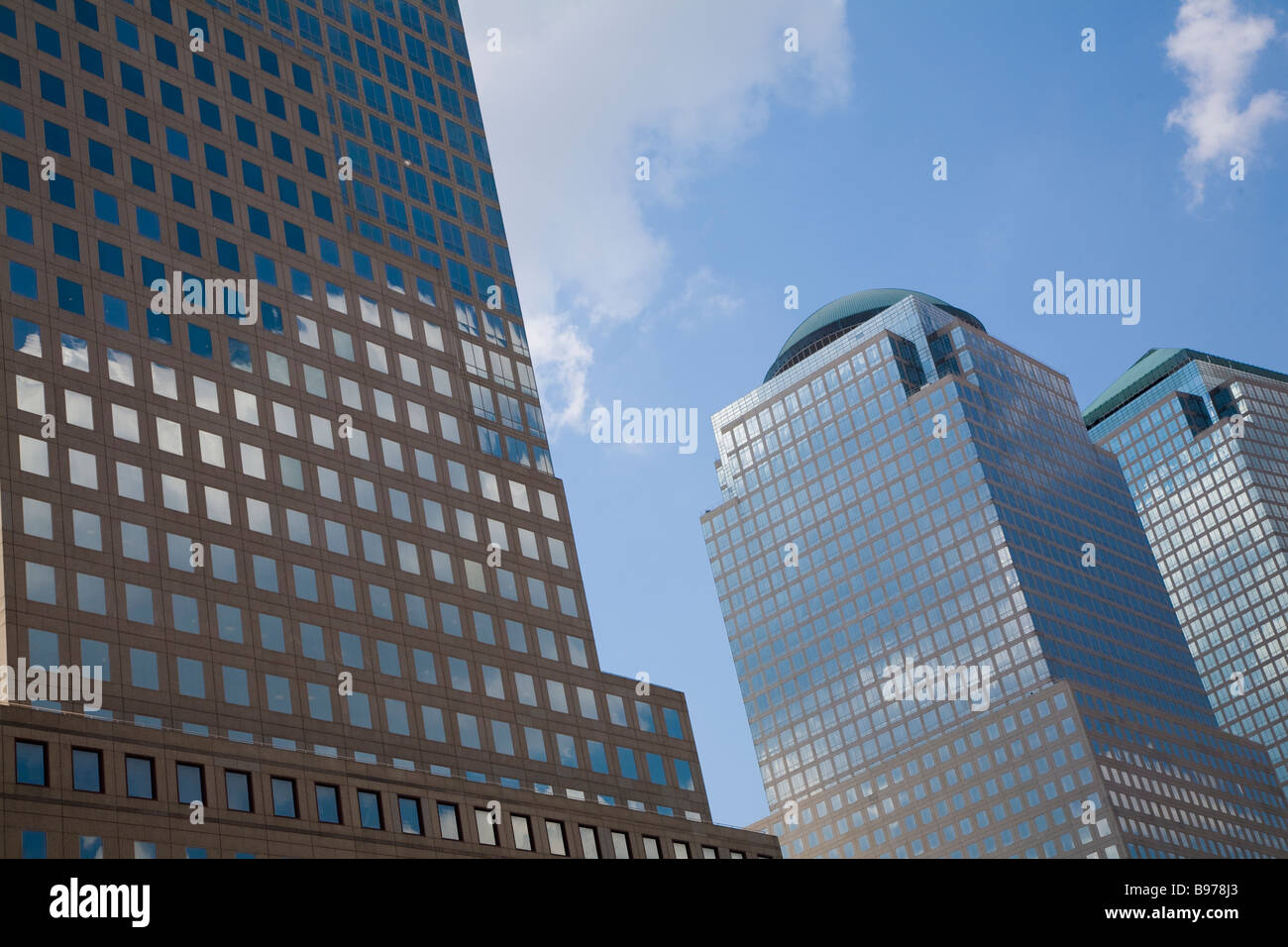 urban view at modern glass building with reflection on blue sky Stock ...
