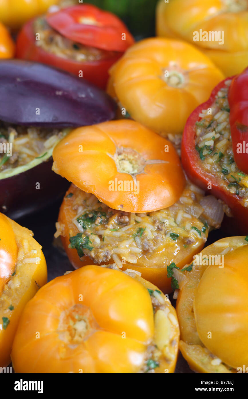 Oven ready traditional Greek style stuffed vegetables with yellow and ...