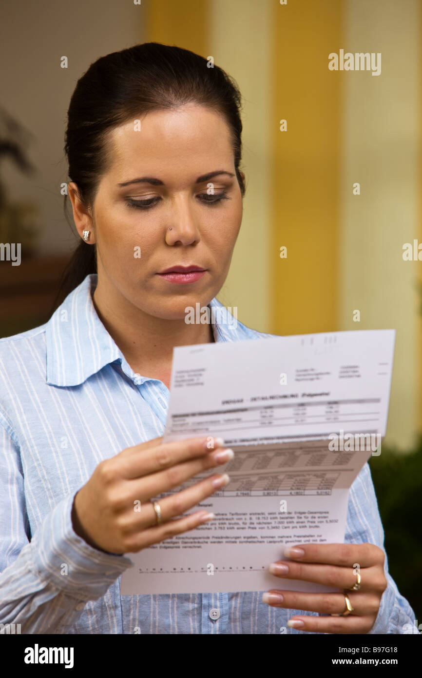 Woman with open invoices Stock Photo - Alamy