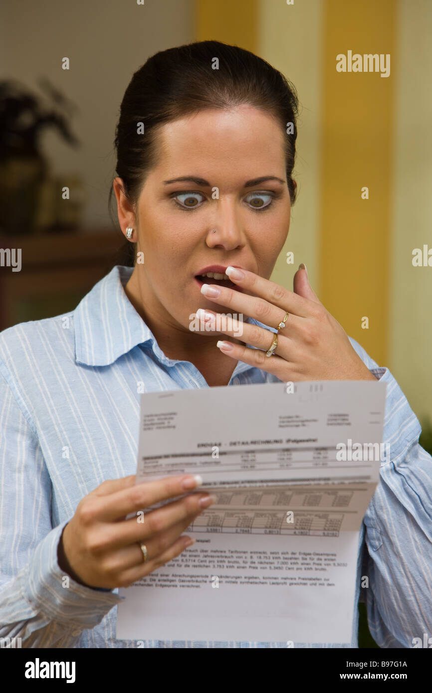 Woman with open invoices Stock Photo - Alamy