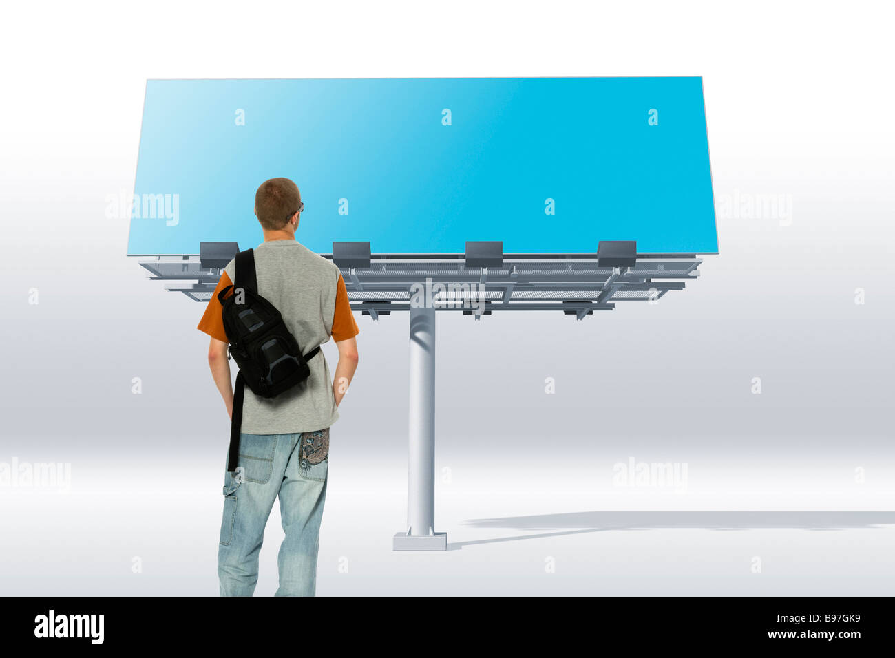 Man looking at empty billboard Stock Photo - Alamy