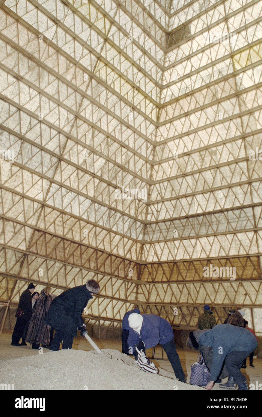 Muscovites gather the soil inside the Alexander Golod Pyramid on ...