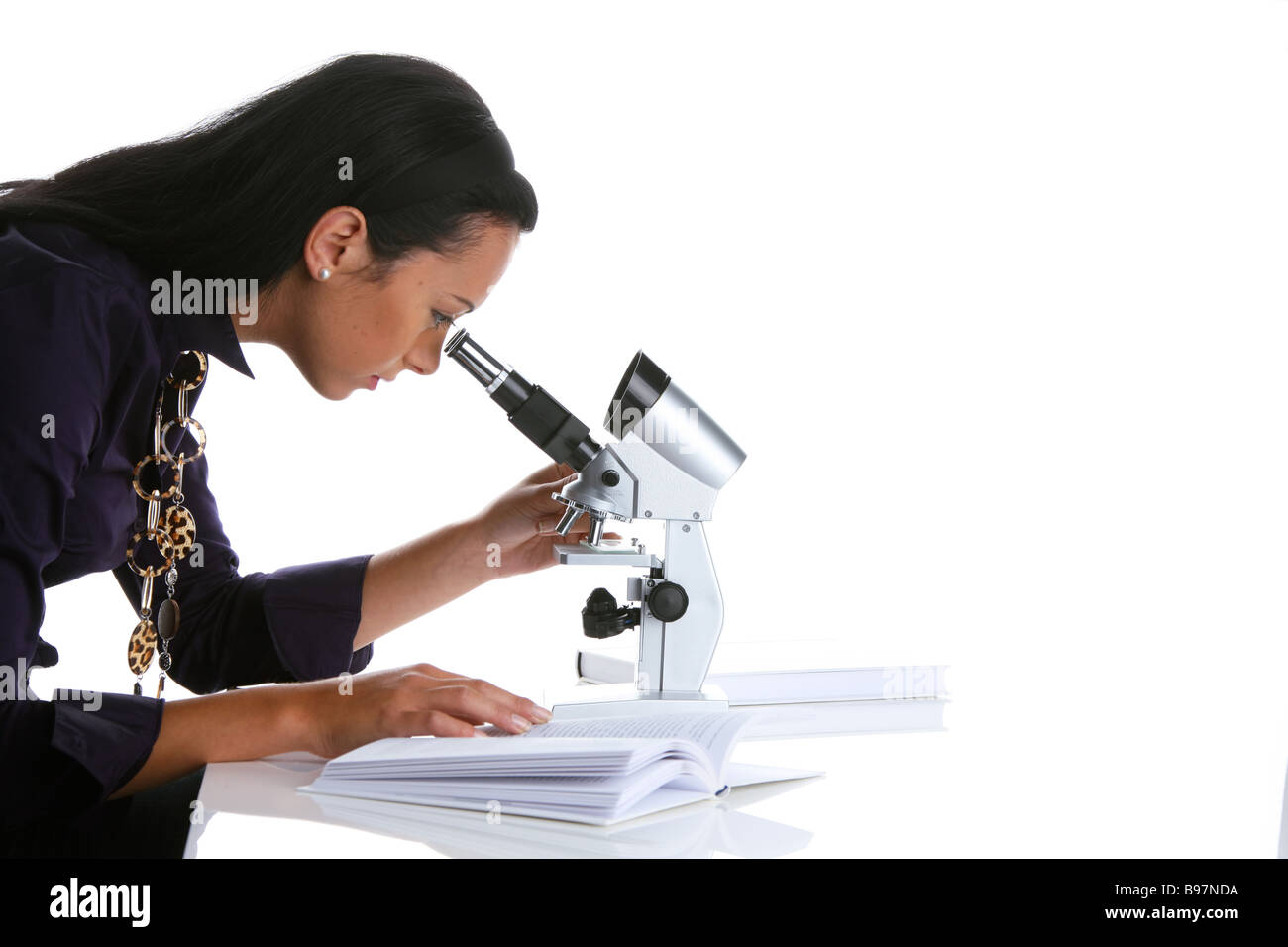 Young woman with a microscope Stock Photo - Alamy