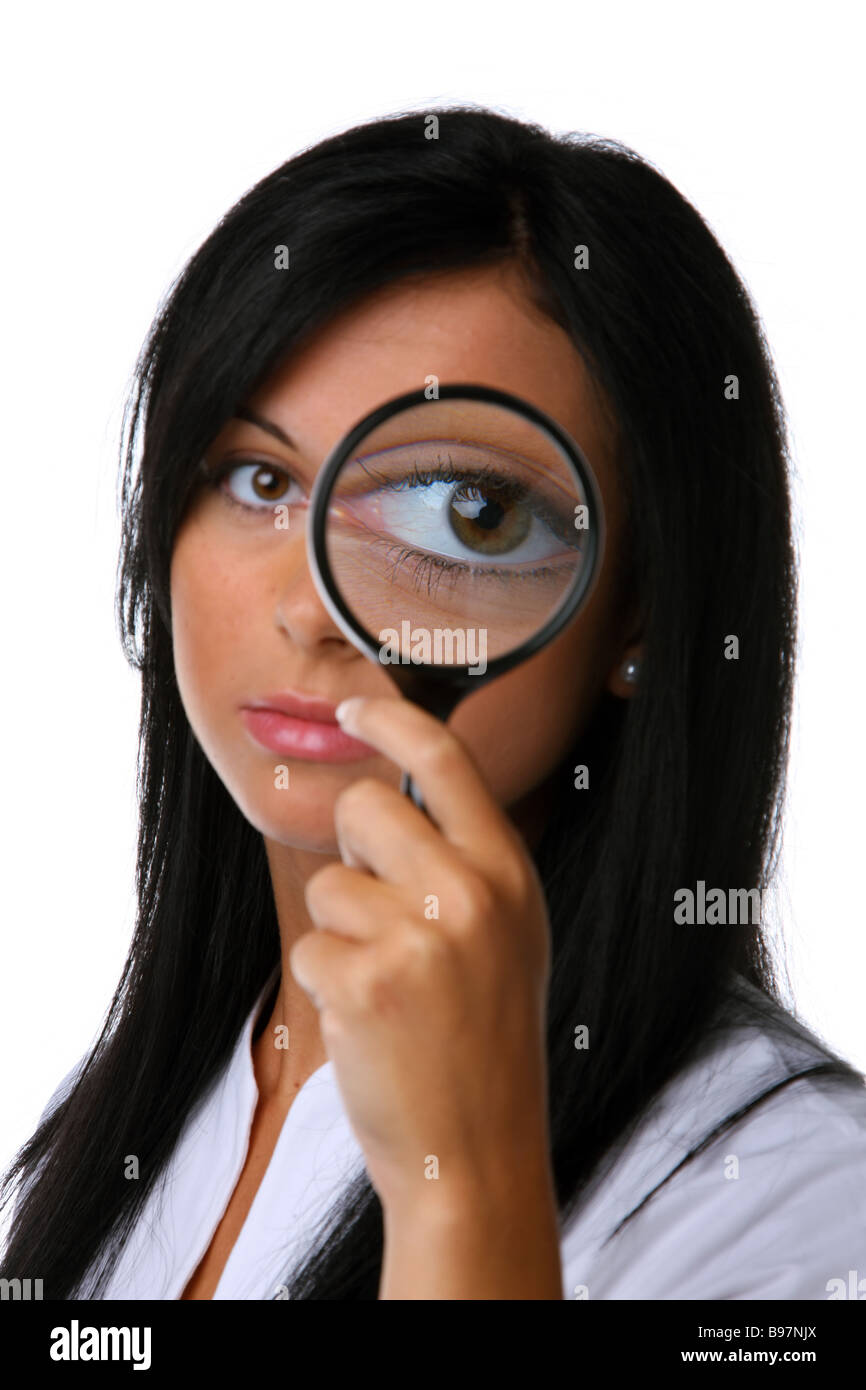 Young woman with magnifying glass Stock Photo - Alamy