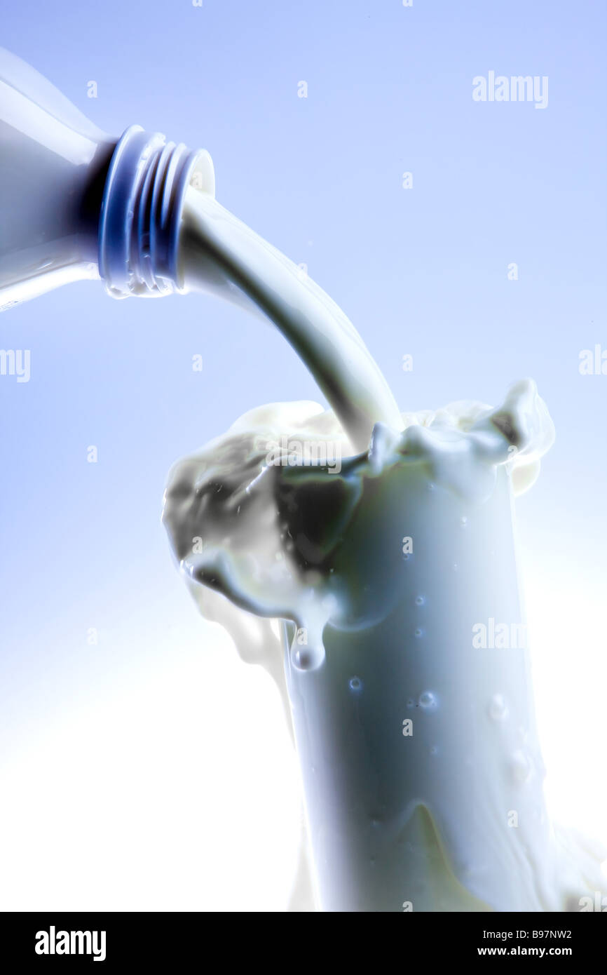 Fresh milk is poured into a glass Stock Photo - Alamy