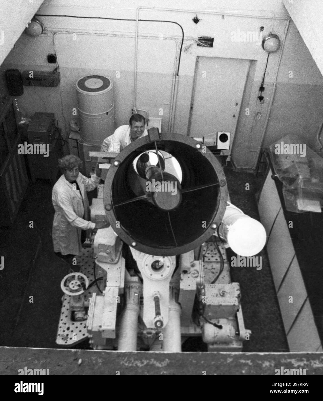 Employees at the Central Aerological Observatory using a laser locator ...