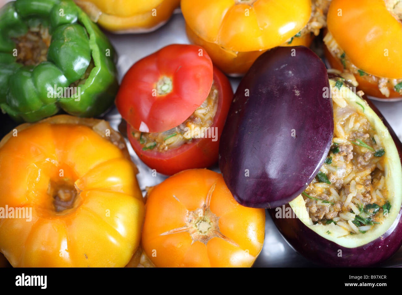 Oven ready traditional Greek style stuffed vegetables with yellow and ...