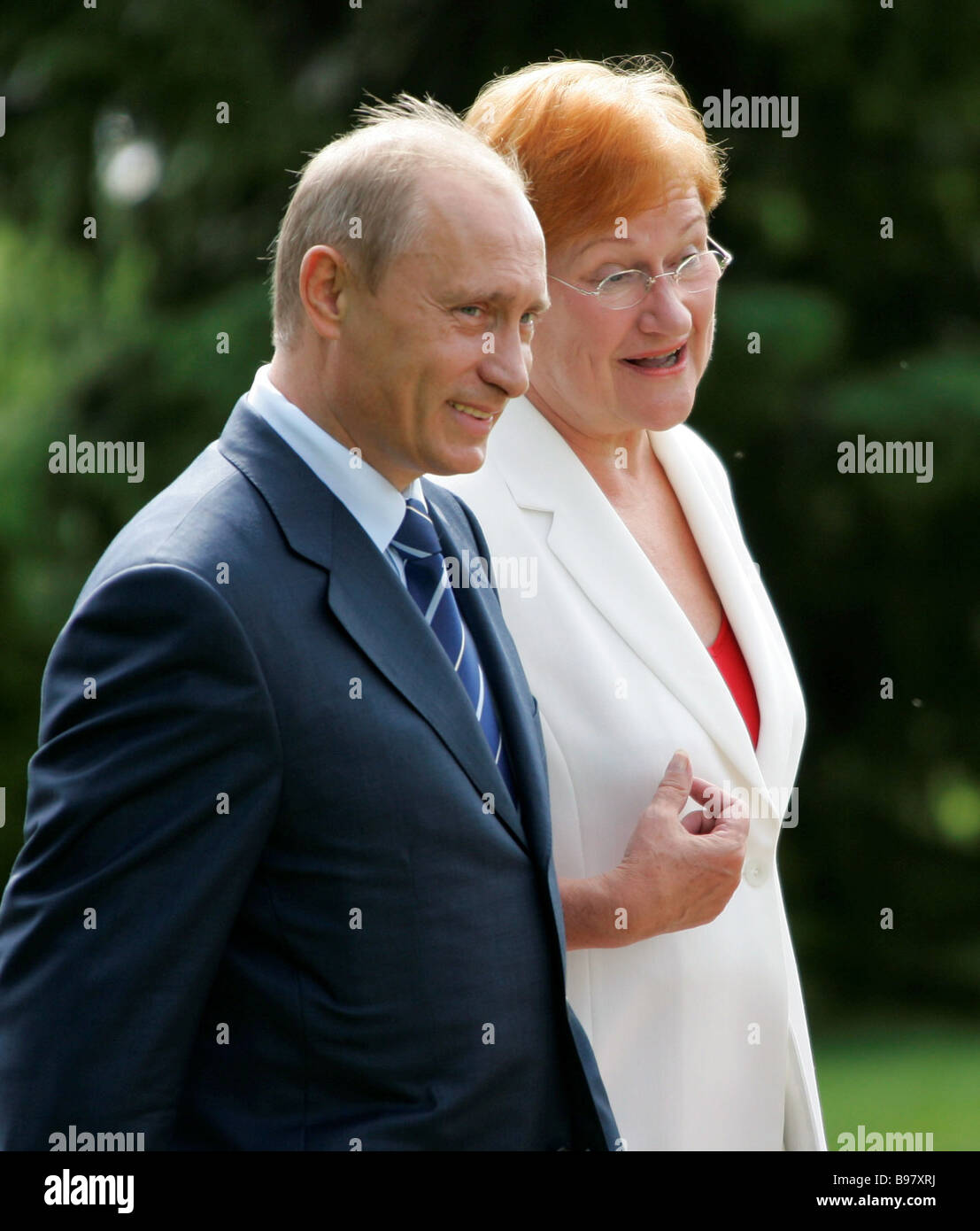 Presidents Vladimir Putin of Russia and Tarja Halonen of Finland make a ...