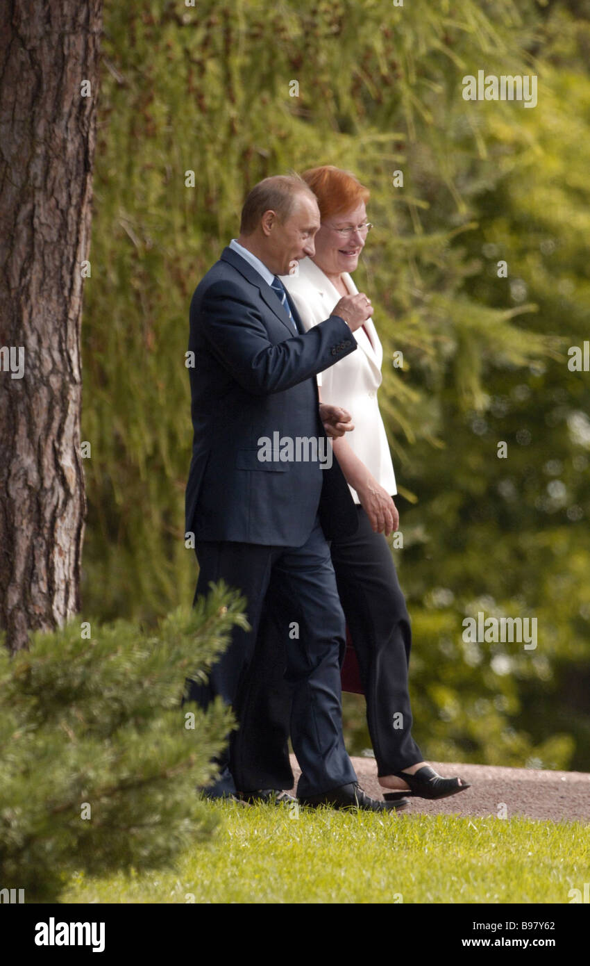 Presidents Vladimir Putin of Russia and Tarja Halonen of Finland make a ...