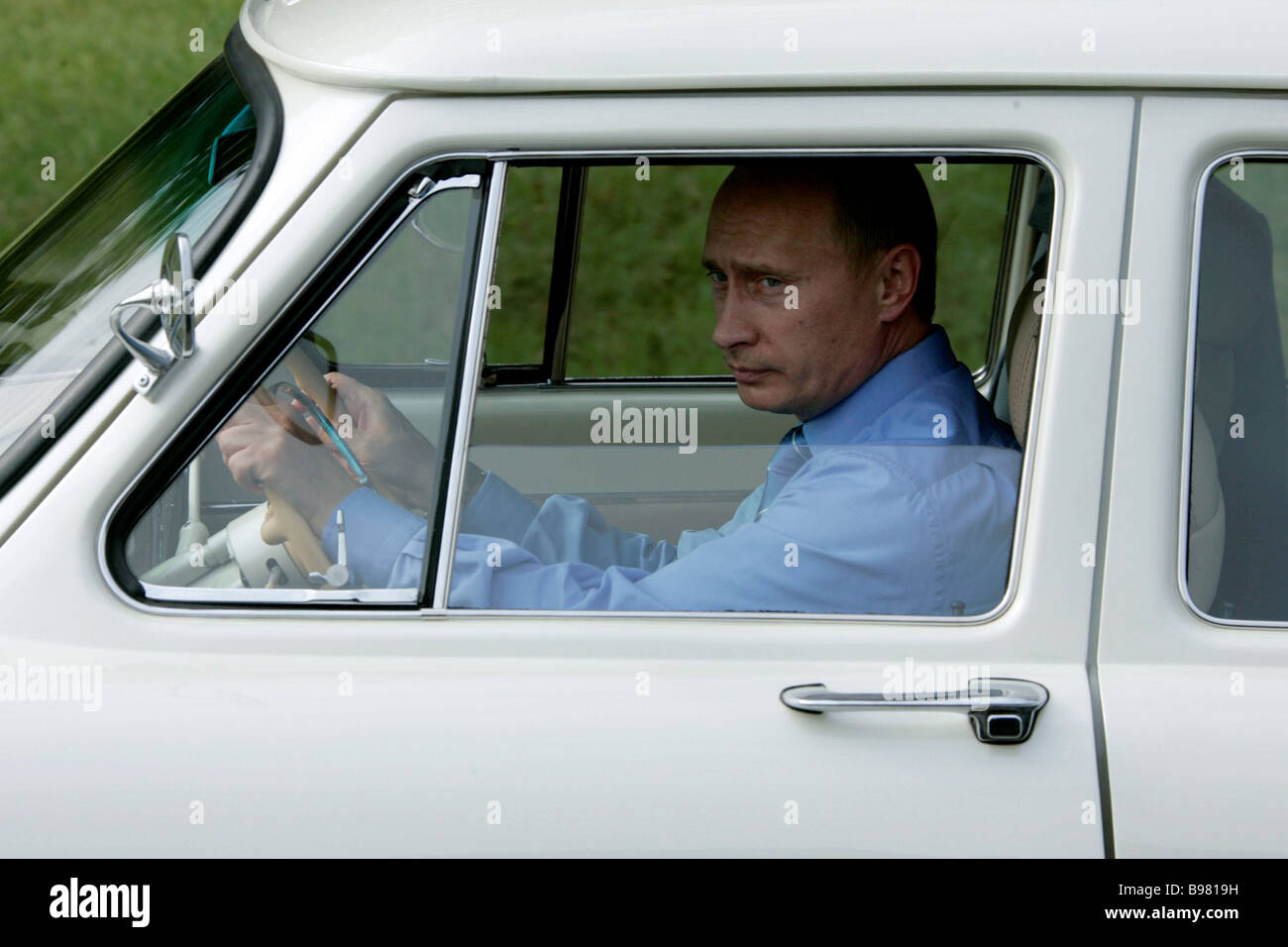 Russian President Vladimir Putin driving a GAZ 21 Volga 1956 to the ...