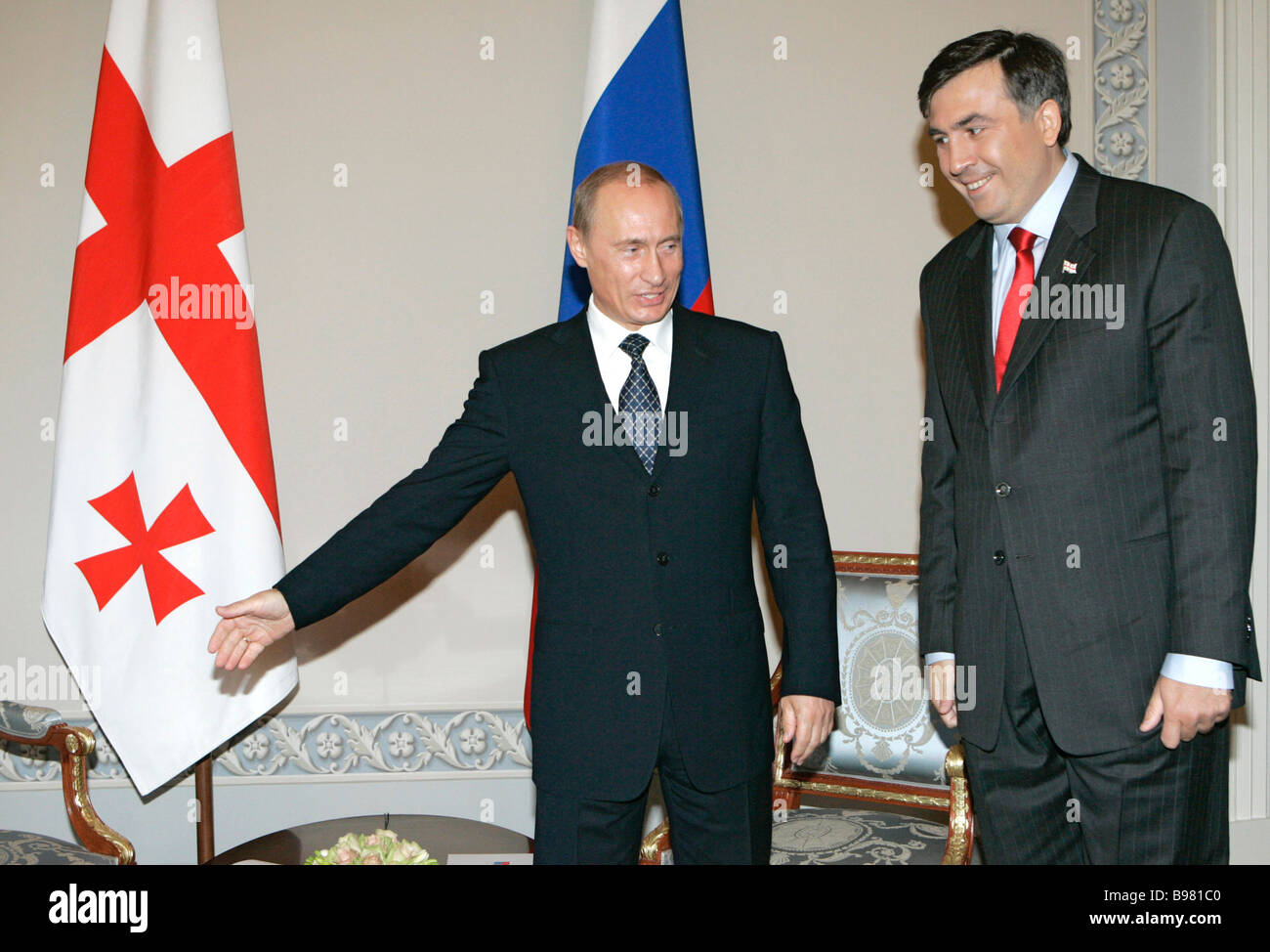 Russian President Vladimir Putin left and Georgian President Mikheil ...