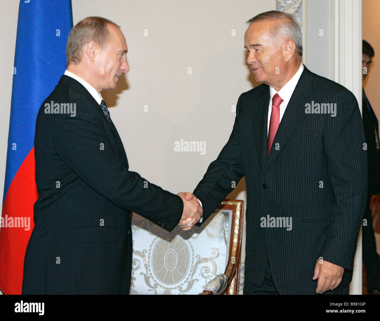 Russian President Vladimir Putin Left And Uzbek President Islam Karimov