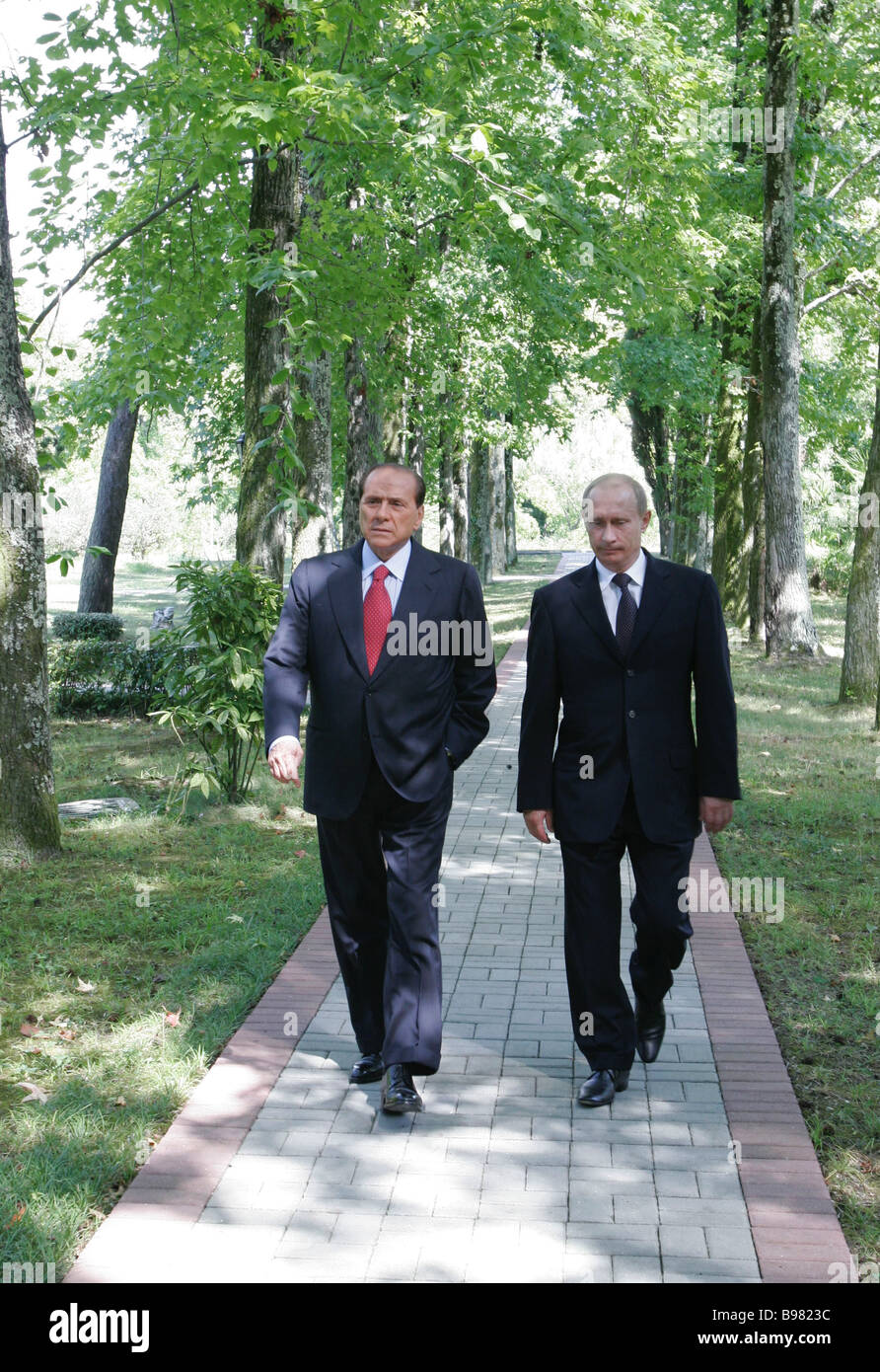 President Vladimir Putin right at a stroll with Italian Prime Minister ...