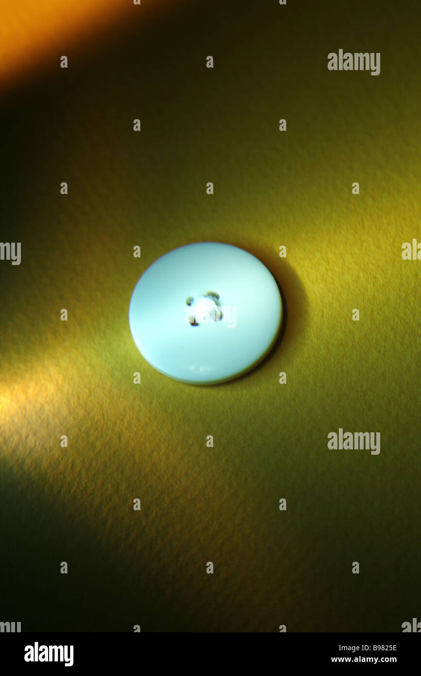 a single white button Stock Photo - Alamy