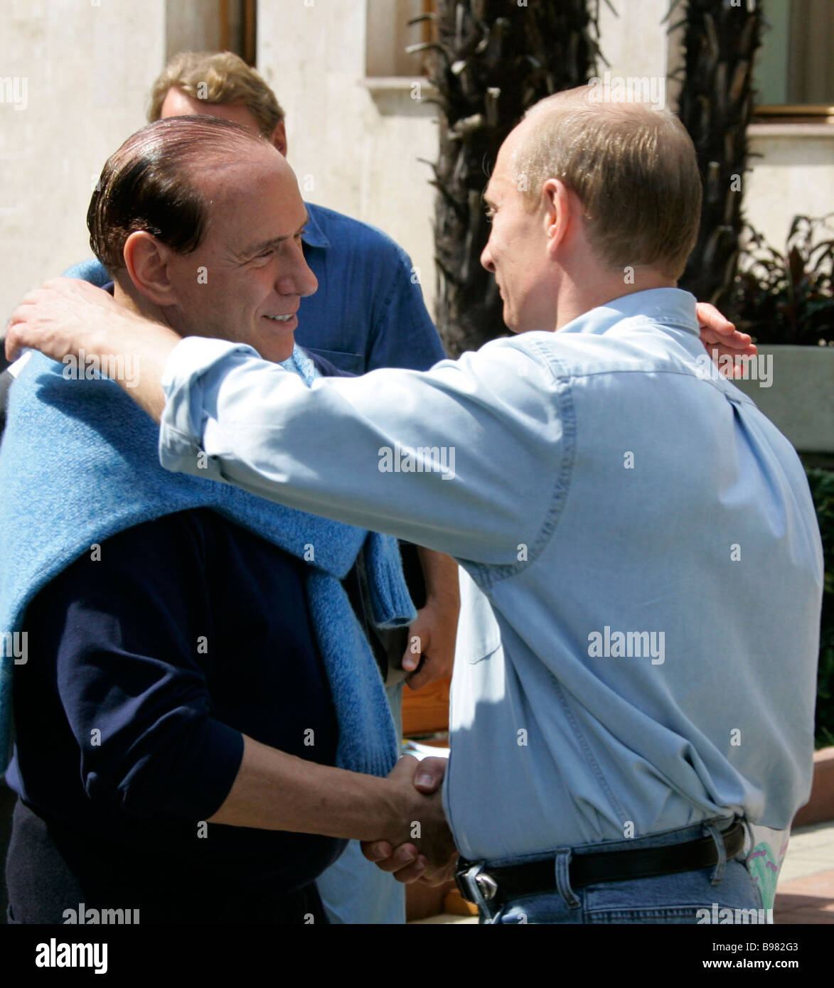 Russian President Vladimir Putin saying good bye to Italian Prime ...