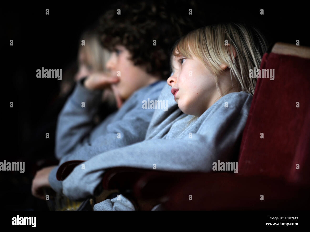 CHILDREN WATCHING A MOVIE AT THE CUBE MICROPLEX INDEPENDENT CINEMA IN ...