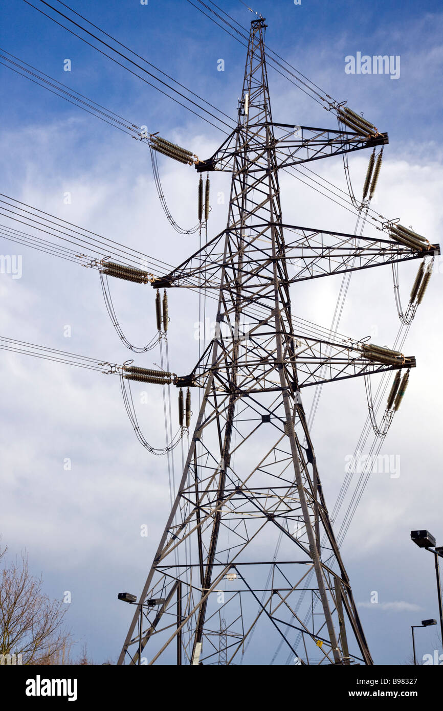 ELECTRICAL POWER PYLON WITH SUPPLY CABLES AGAINST A CLOUDY SKY, Credit ...
