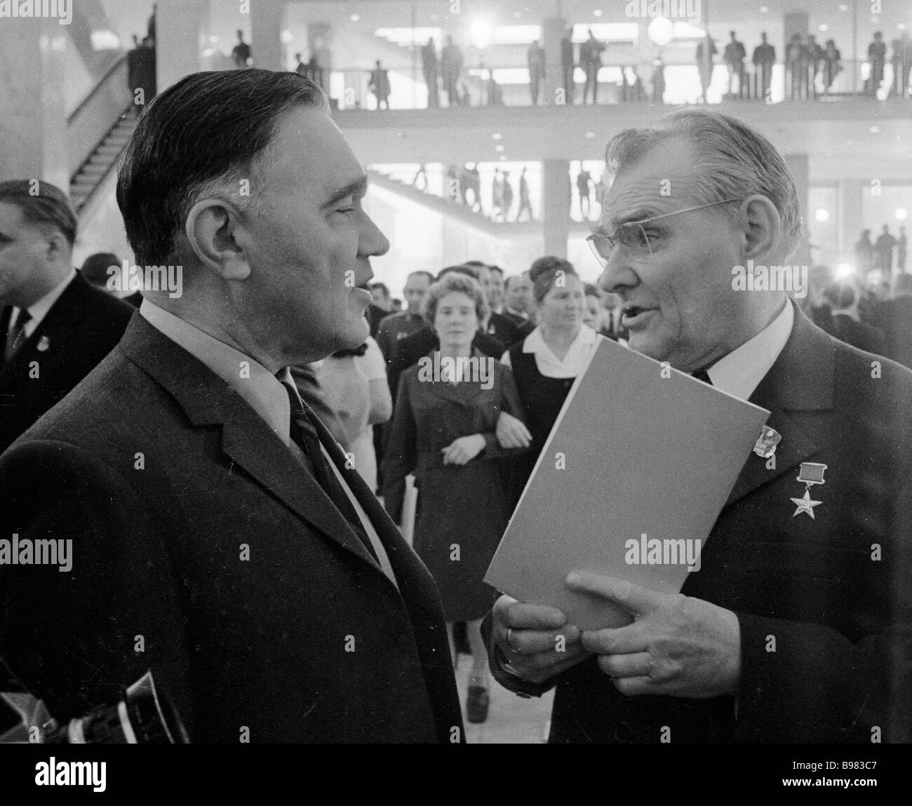 Aircraft designer Alexander Yakovlev left talking to sculptor Yevgeny ...