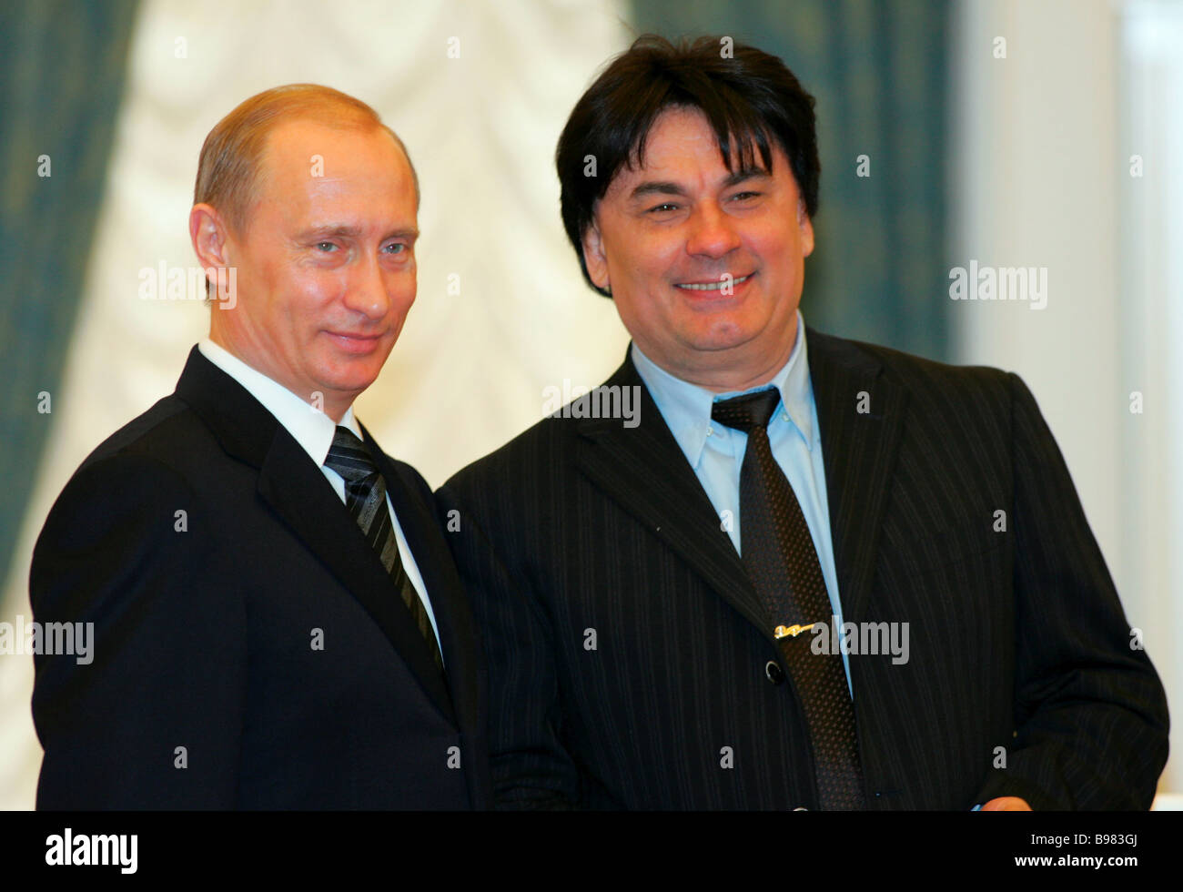 Russia s President Vladimir Putin left with pop singer Alexander Serov ...