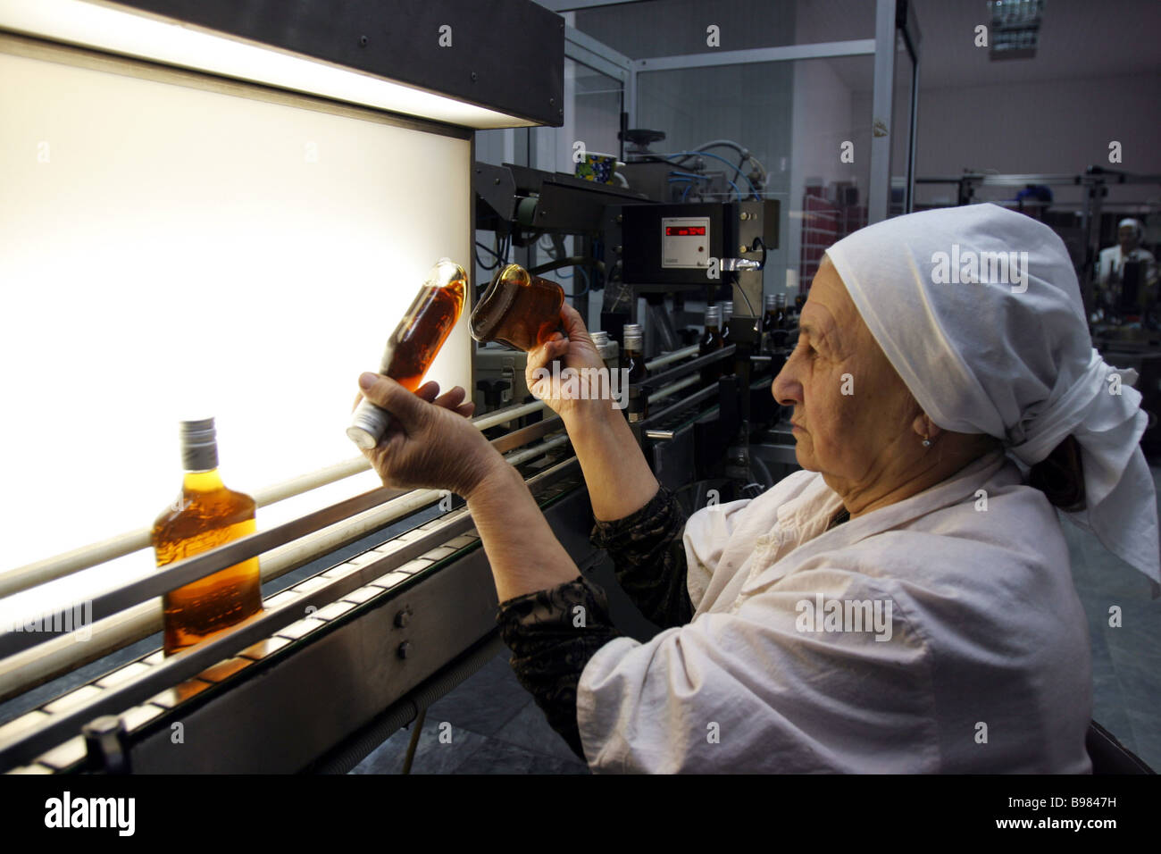 Conveyor line at the Derbent Brandy Combine Stock Photo - Alamy