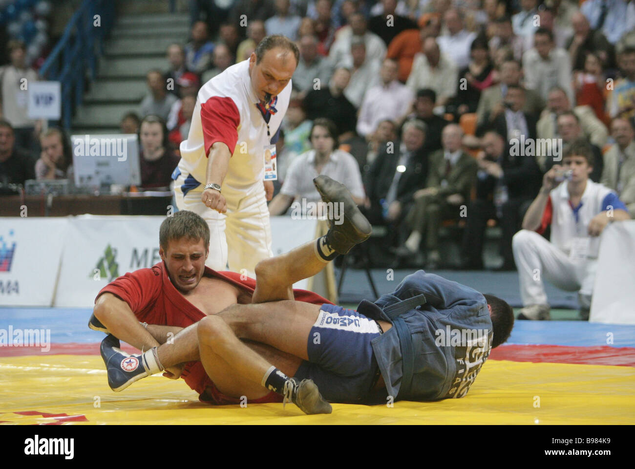 The member of Russian Sambo team Alexander Sharov left and Georgian ...