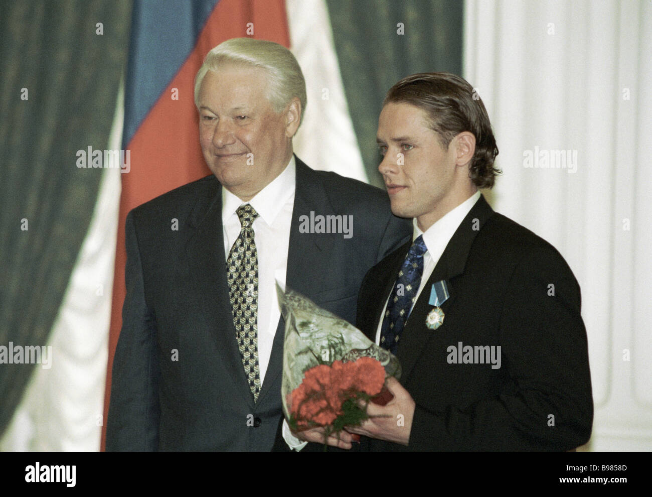 Russian President Boris Yeltsin left and Pavel Bure captain of the ...