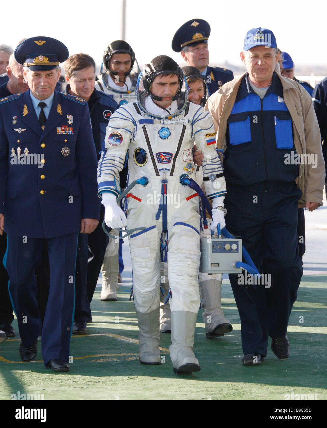 Russian cosmonaut Yury Malenchenko in the center of the 16th ISS ...