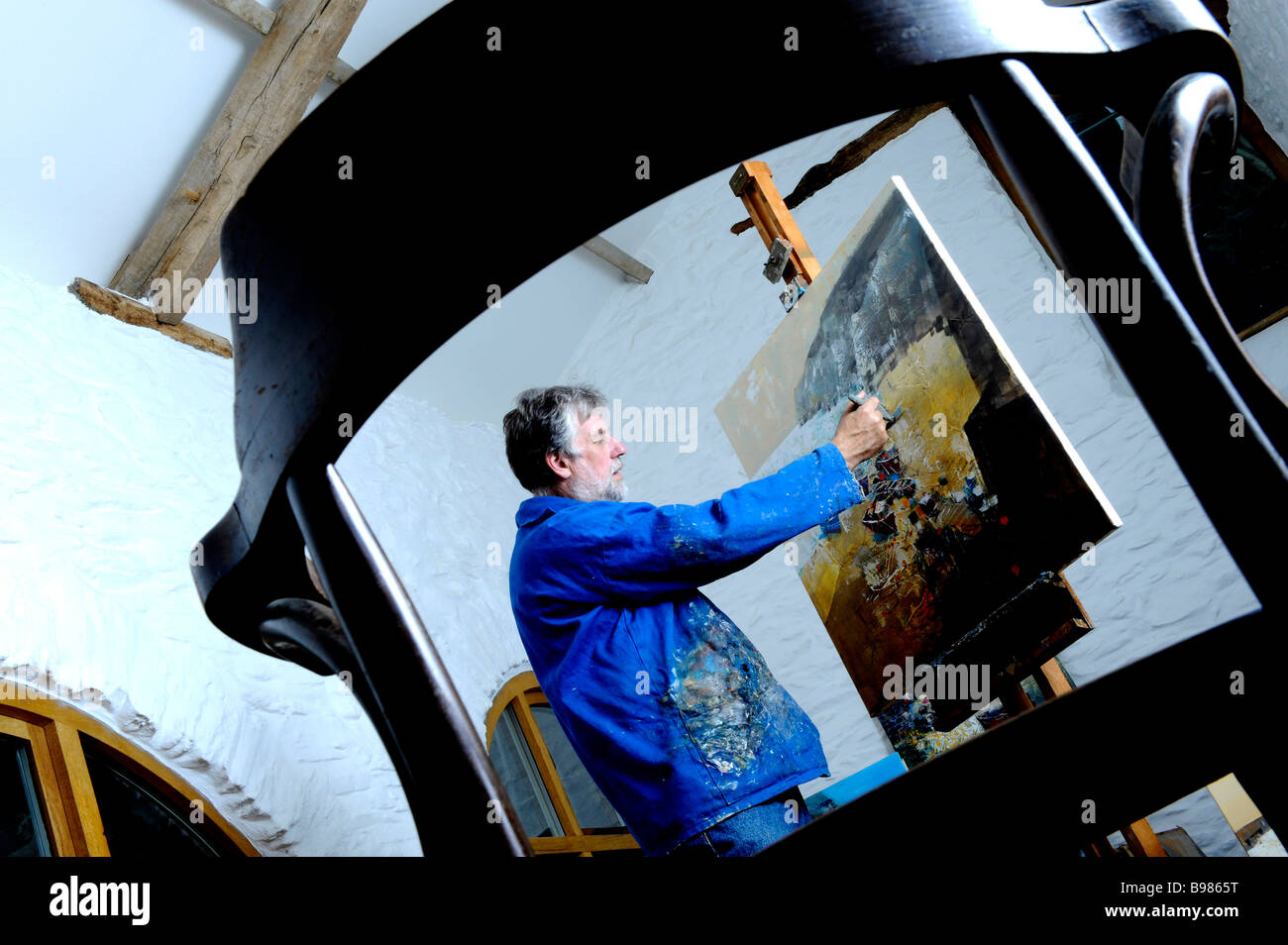 artist mike bernard in his studio nr Combe Martin Stock Photo - Alamy