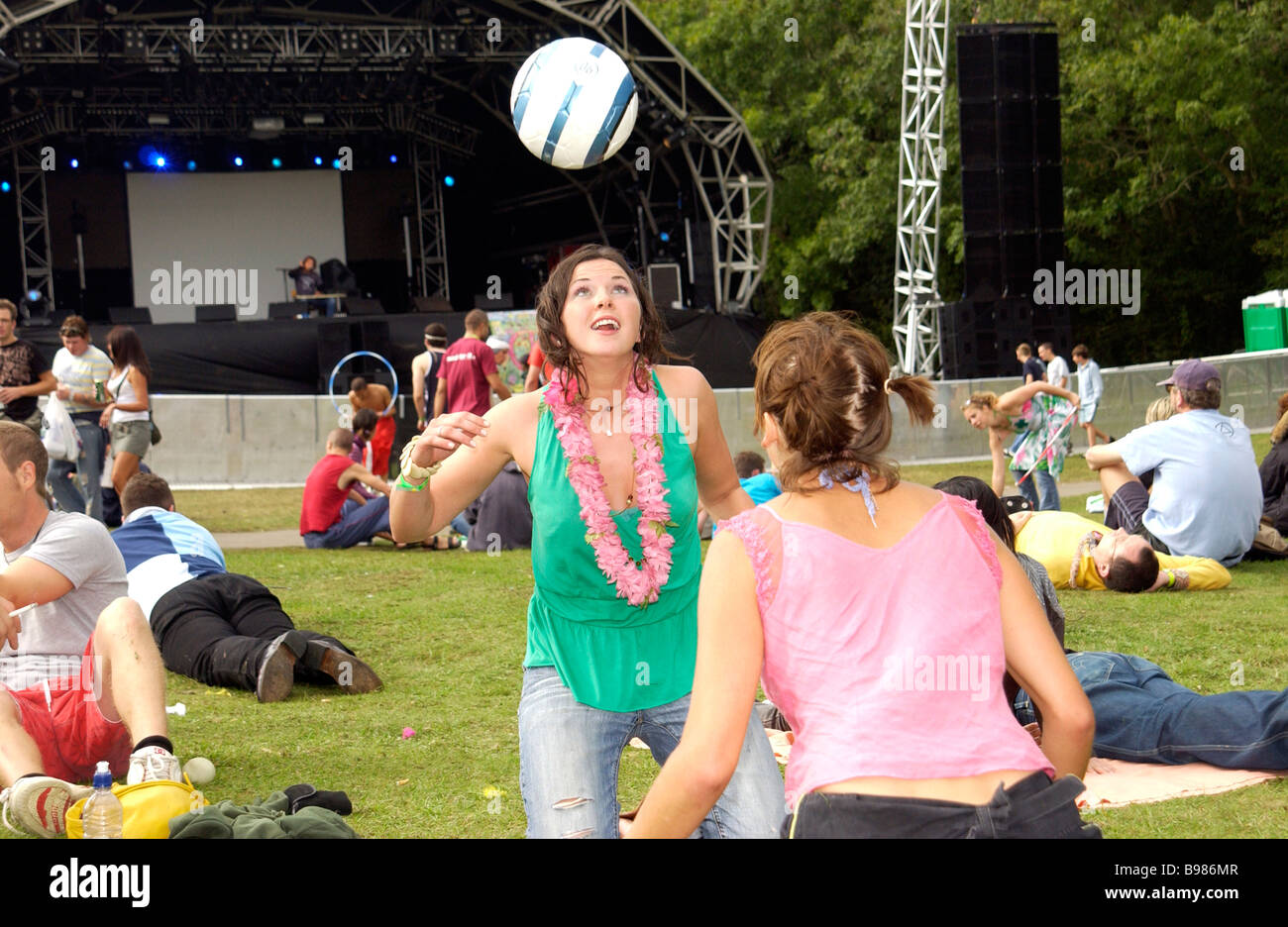 Festival goers have a quick game of 'keepie uppie' between acts at ...