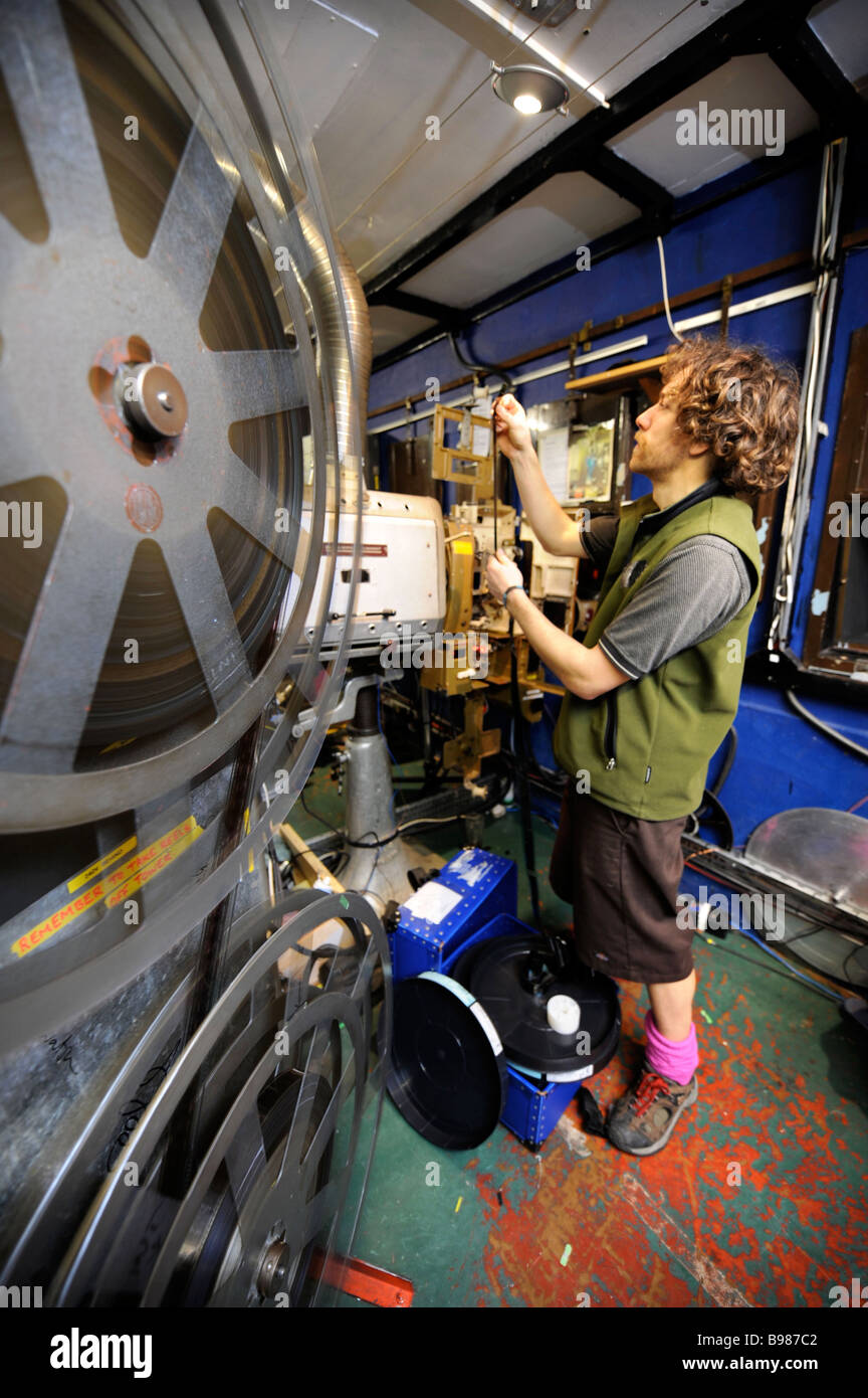 A PROJECTIONIST WITH A BELL HOWELL GAUMONT PROJECTOR AT THE CUBE ...