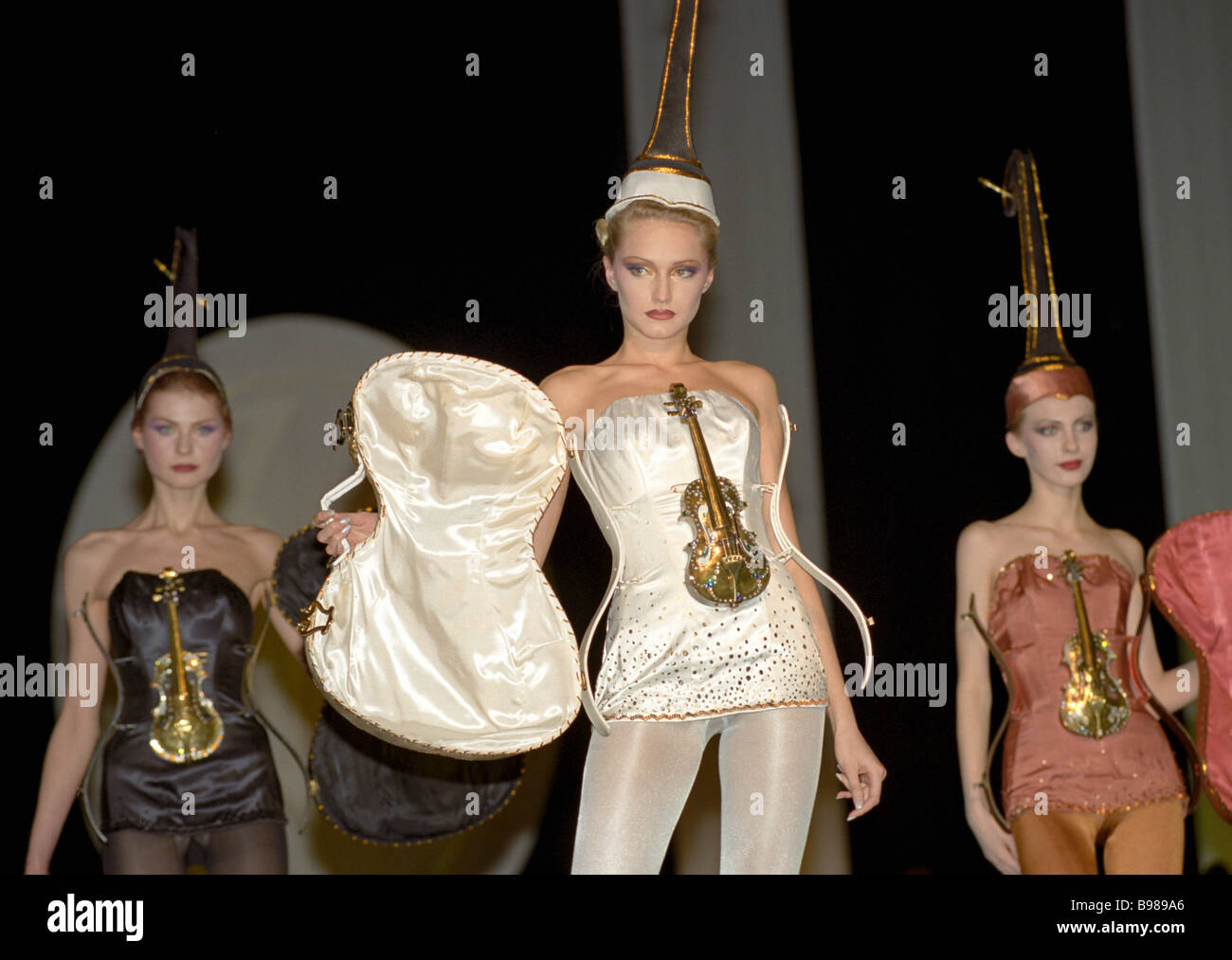 Models demonstrating new clothes at a gala show marking the 10th ...