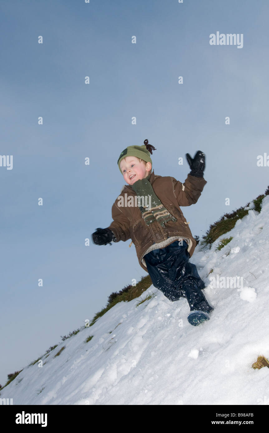 Boy running down hill hi-res stock photography and images - Alamy