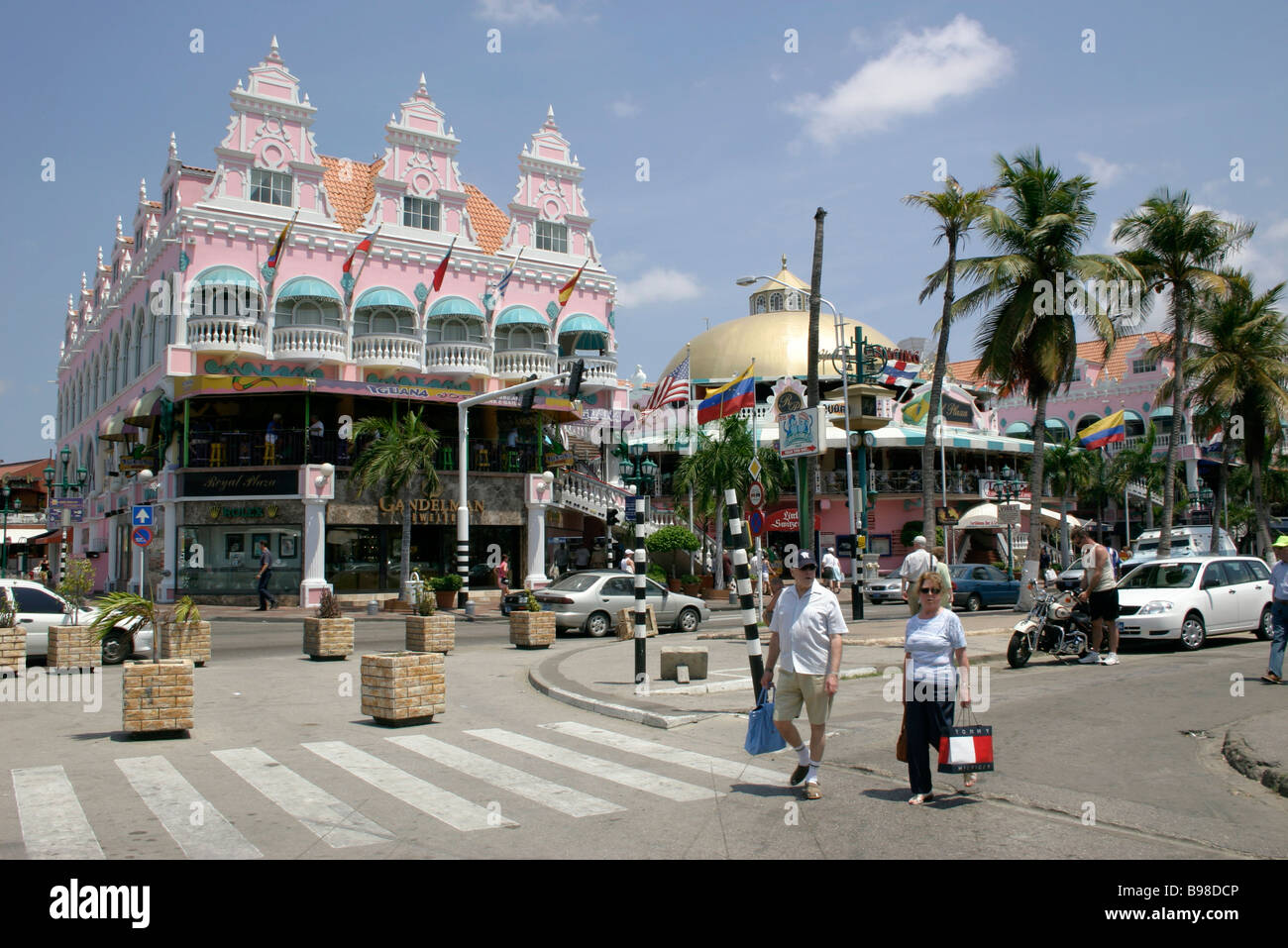 Dutch Antilles. Town. Large gabled building. Pink paintwork. Dome. Palm ...