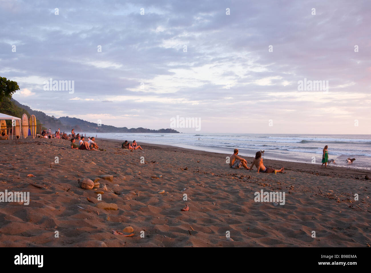 Beachgoers watching sunset in Dominical, Costa Rica Stock Photo - Alamy